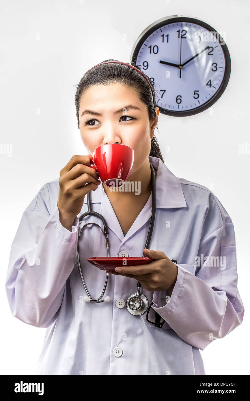 asian female doctor shooting in studio Stock Photo - Alamy