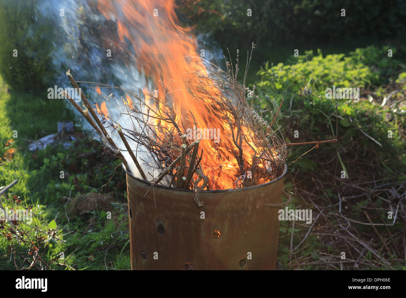 Fire in garden incinerator in Kent, England, UK Stock Photo - Alamy