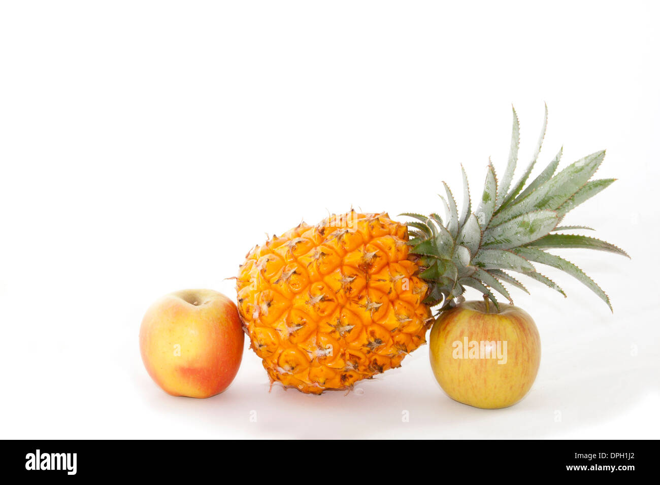 display of two shiny apples and a pine apple Stock Photo - Alamy