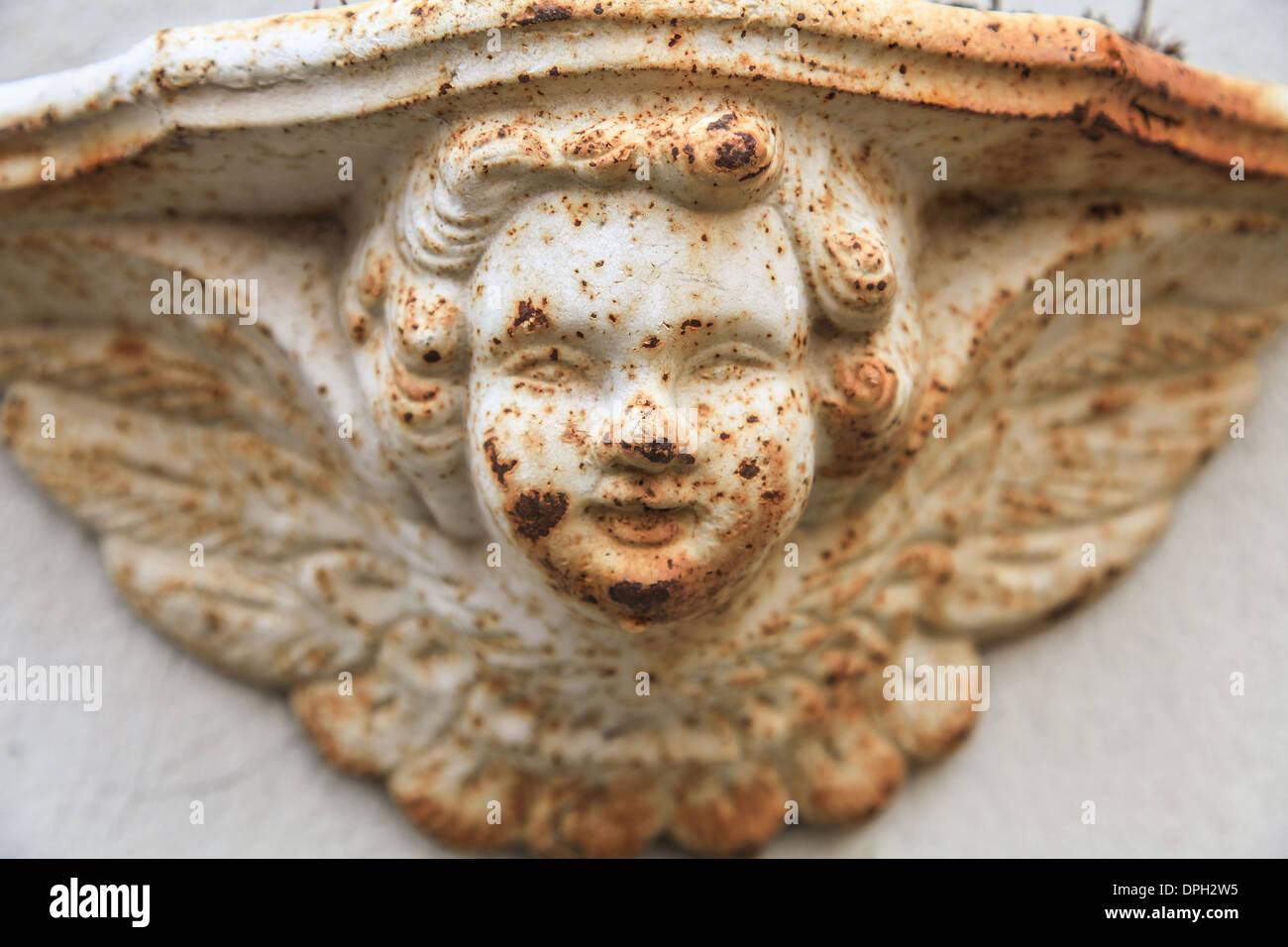 Iron angel on the wall Stock Photo - Alamy