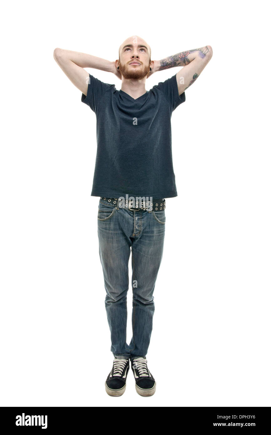 Young man with arms behind his head Stock Photo - Alamy