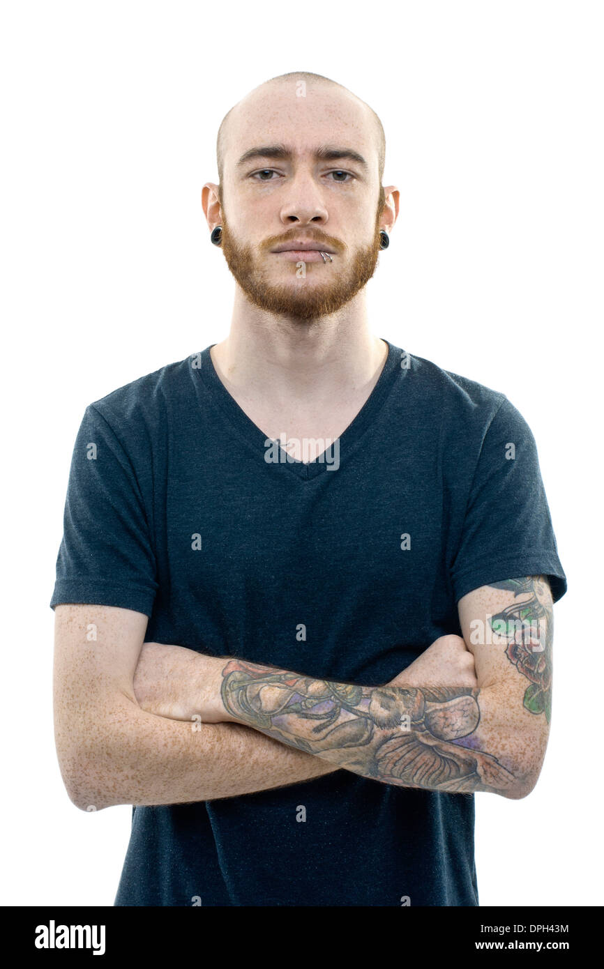 Young man with arms folded Stock Photo - Alamy