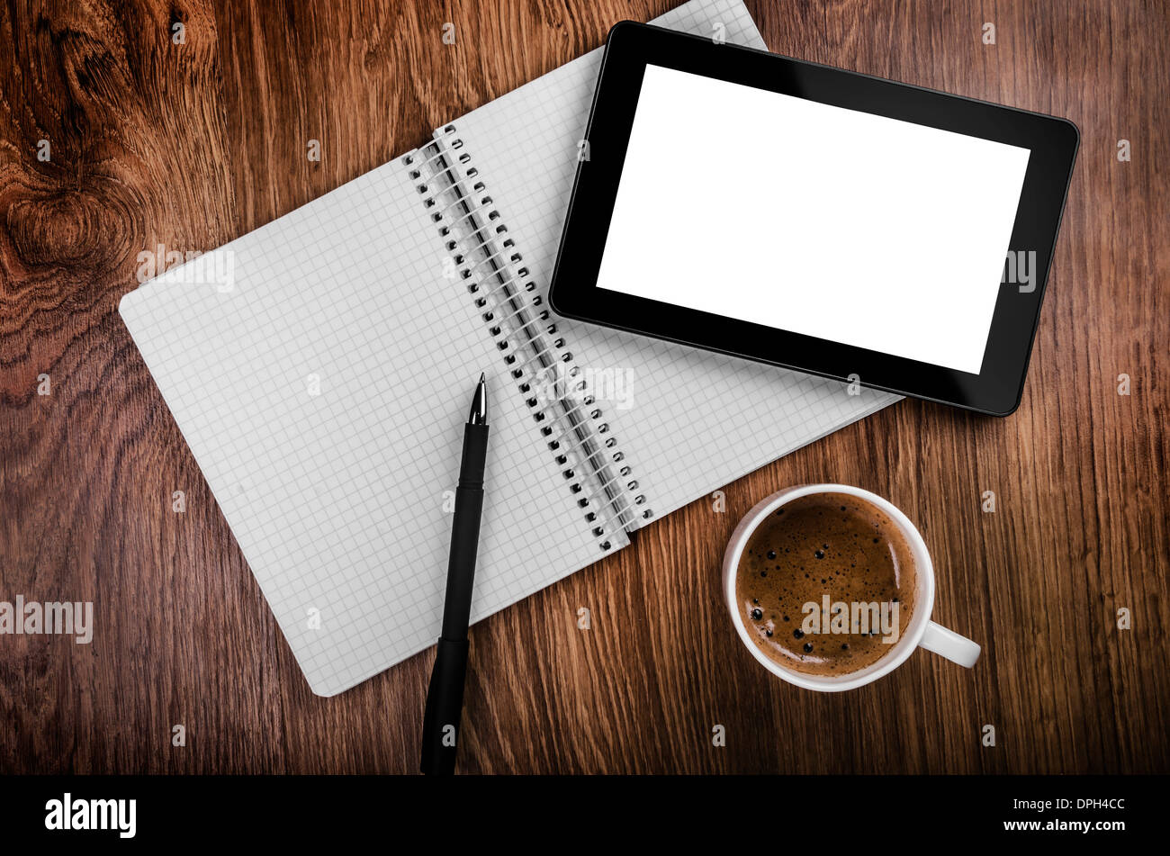 Tablet with an empty screen close to a pen and cup Stock Photo - Alamy