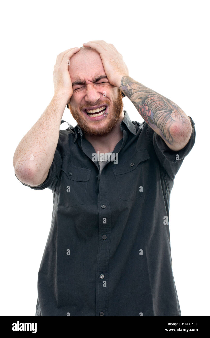 Young man with hands on head Stock Photo - Alamy