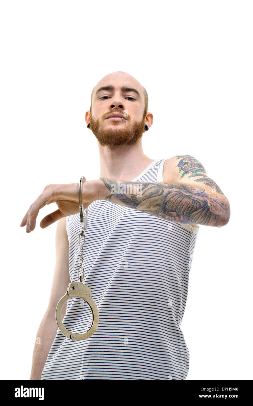 Young man in handcuffs Stock Photo - Alamy