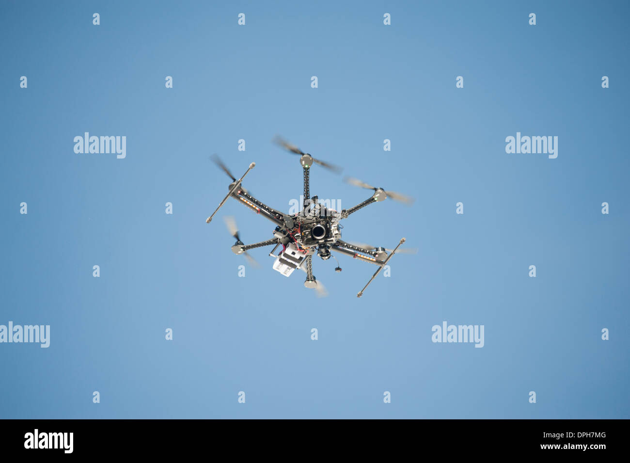 An unmanned Aerial Vehicle (UAV) / drone used for aerial surveillance is flying in the air Stock ...