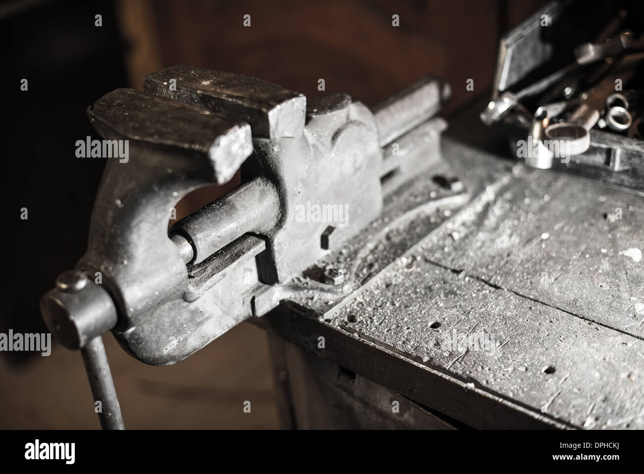 Iron Vice in Workshop. Workshop Desk with Vice Closeup Stock Photo - Alamy