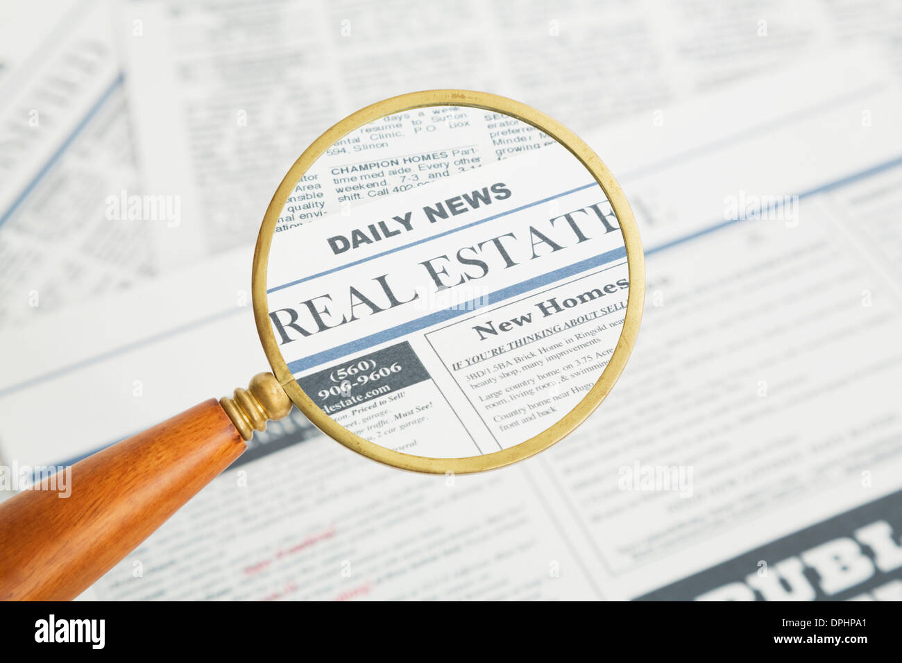 Close-up of newspaper page seen through magnifying glass Stock Photo ...