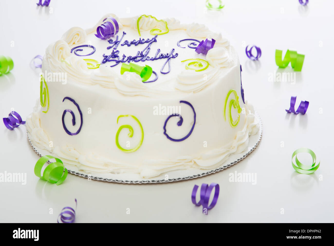 High angle view of birthday cake and streamers Stock Photo - Alamy
