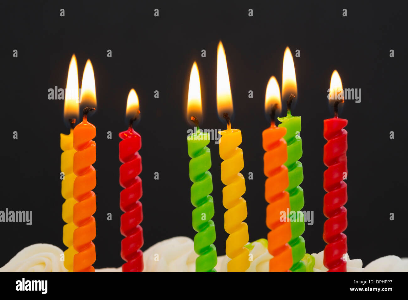 Burning candles on cake Stock Photo - Alamy