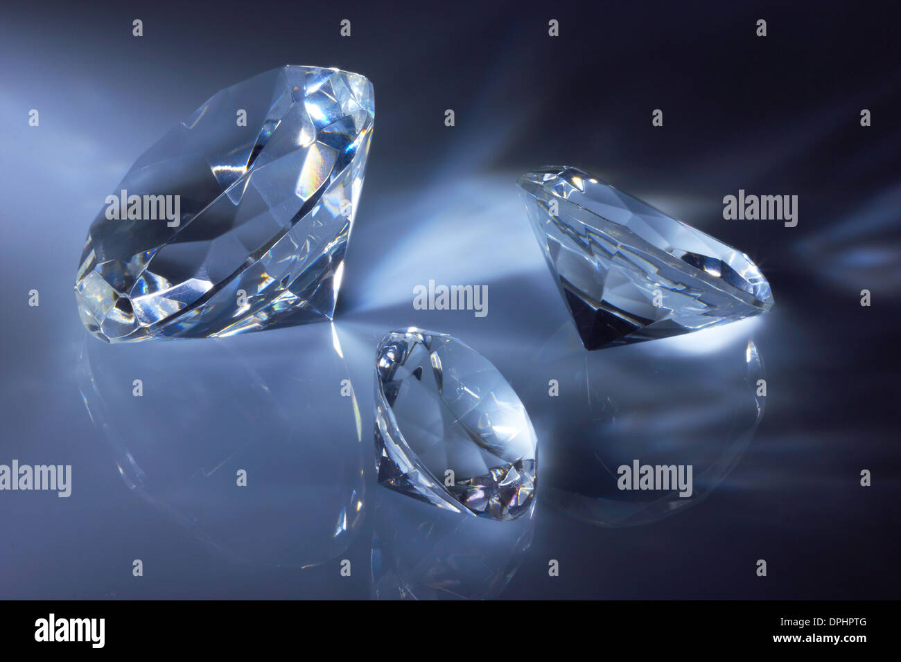 Shiny diamonds jewel on dark blue background Stock Photo - Alamy