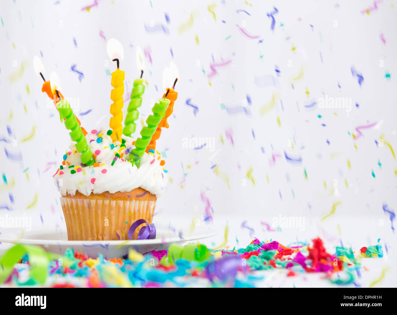 Birthday cupcake and confetti Stock Photo - Alamy