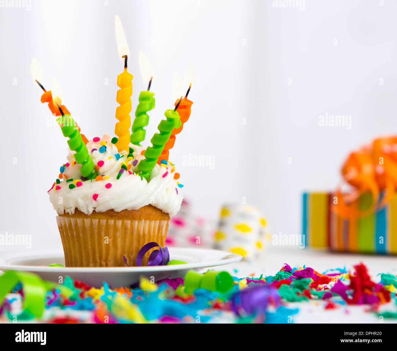 Birthday cupcake with candles Stock Photo - Alamy
