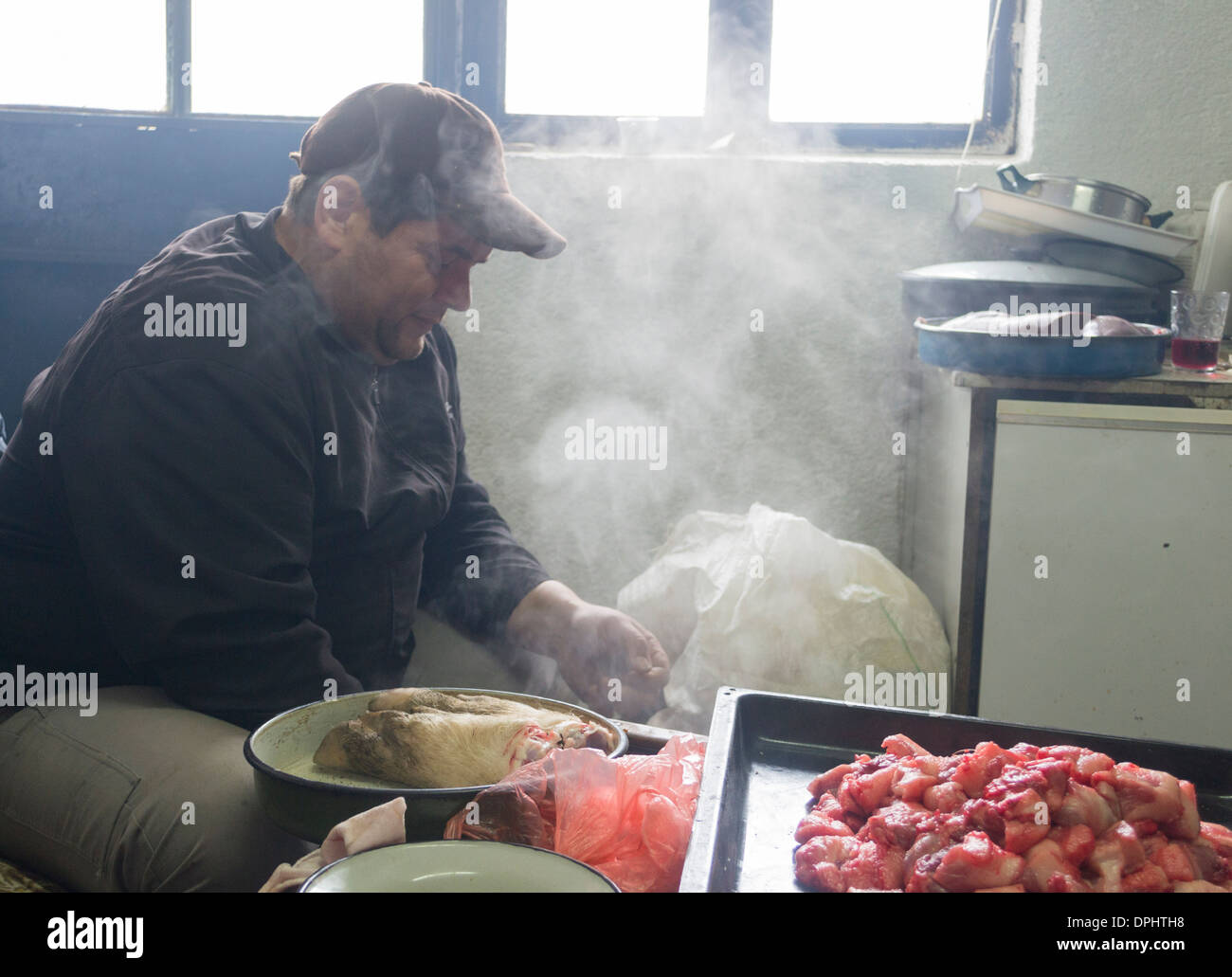 Traditional way of killing a pig in rural Macedonia - Man boiling pork ...