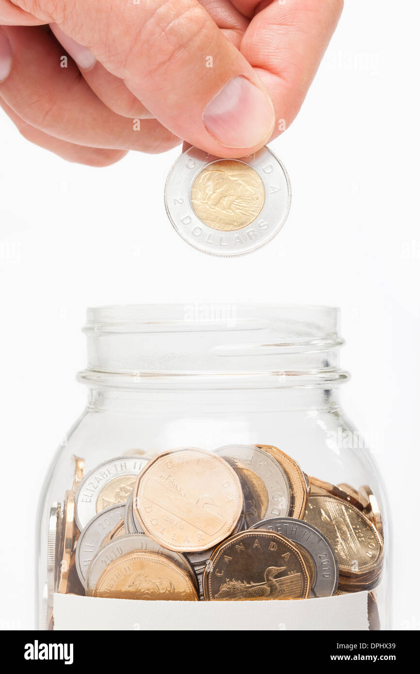Man and dollar coin hi-res stock photography and images - Alamy