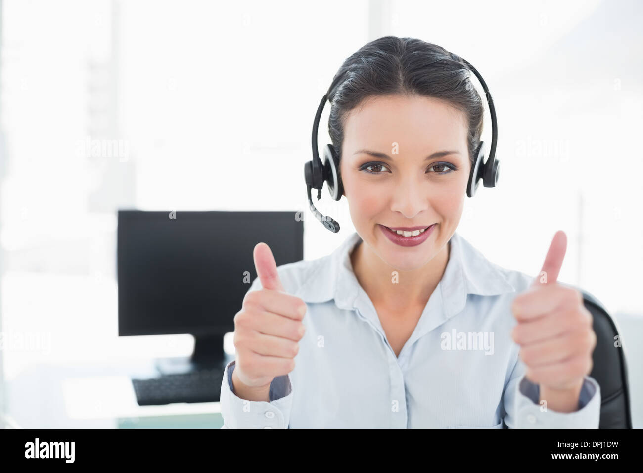 Call centre agent giving thumbs hi-res stock photography and images - Alamy