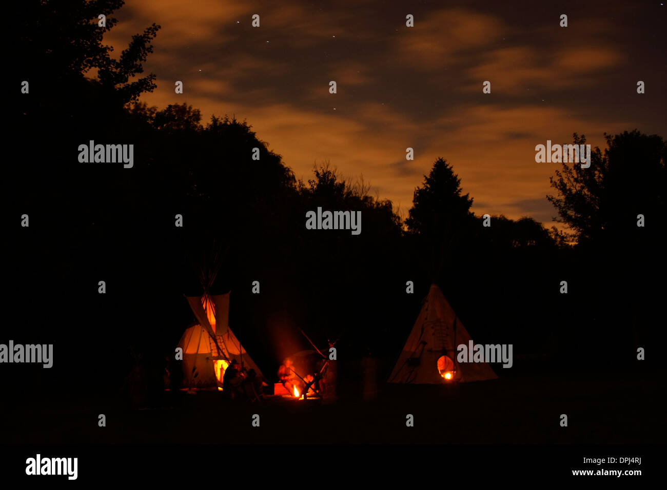 Lakota Tipi glow and campfire at night at Wisconsin Artist Ride Stock ...