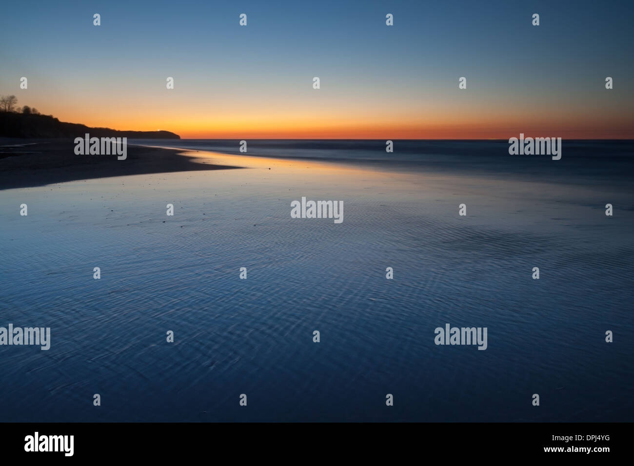 sunset on beach landscape Stock Photo - Alamy