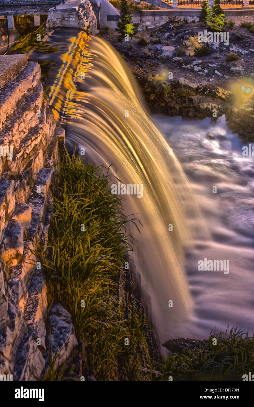 Waterfall over a dam in Menomonee Falls Wisconsin Stock Photo - Alamy