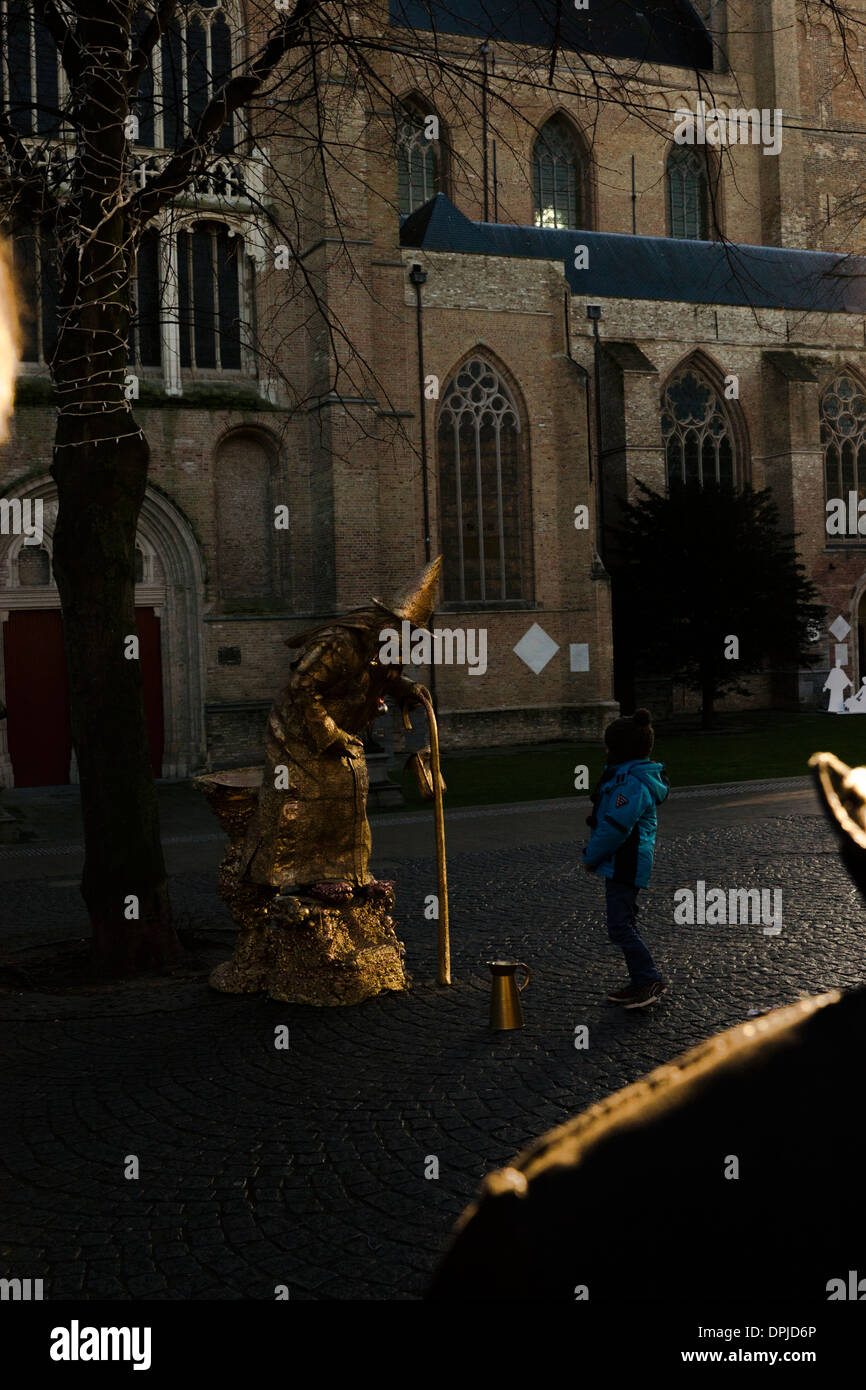 human gold wizard living statue tourist interacting with crowed ...