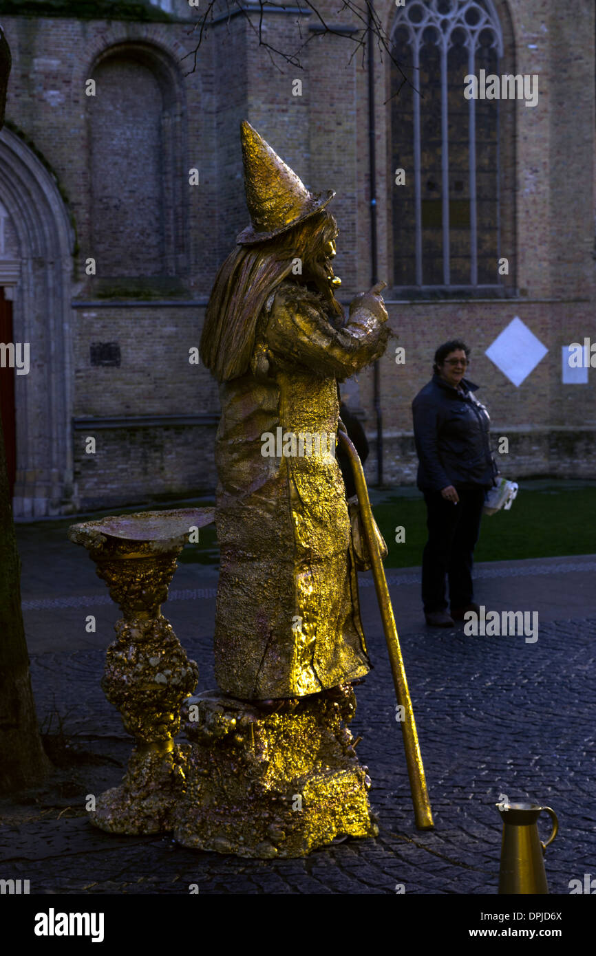 human gold wizard living statue tourist interacting with crowed ...