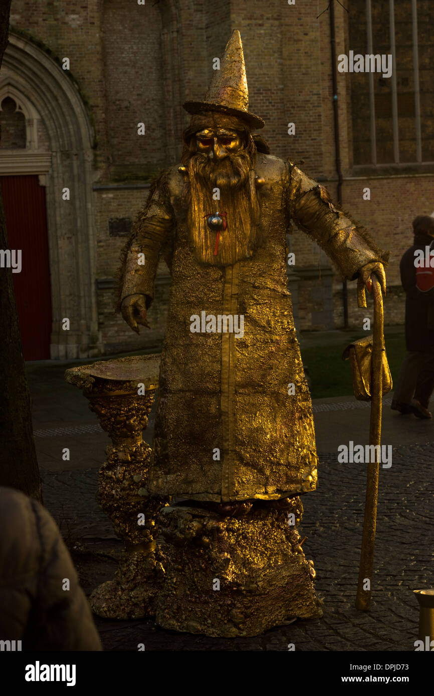 human gold wizard living statue tourist interacting with crowed ...