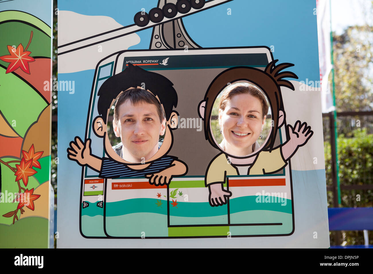 Young couple on the picture frame of Miyajima Ropeway. Itsukushima ...