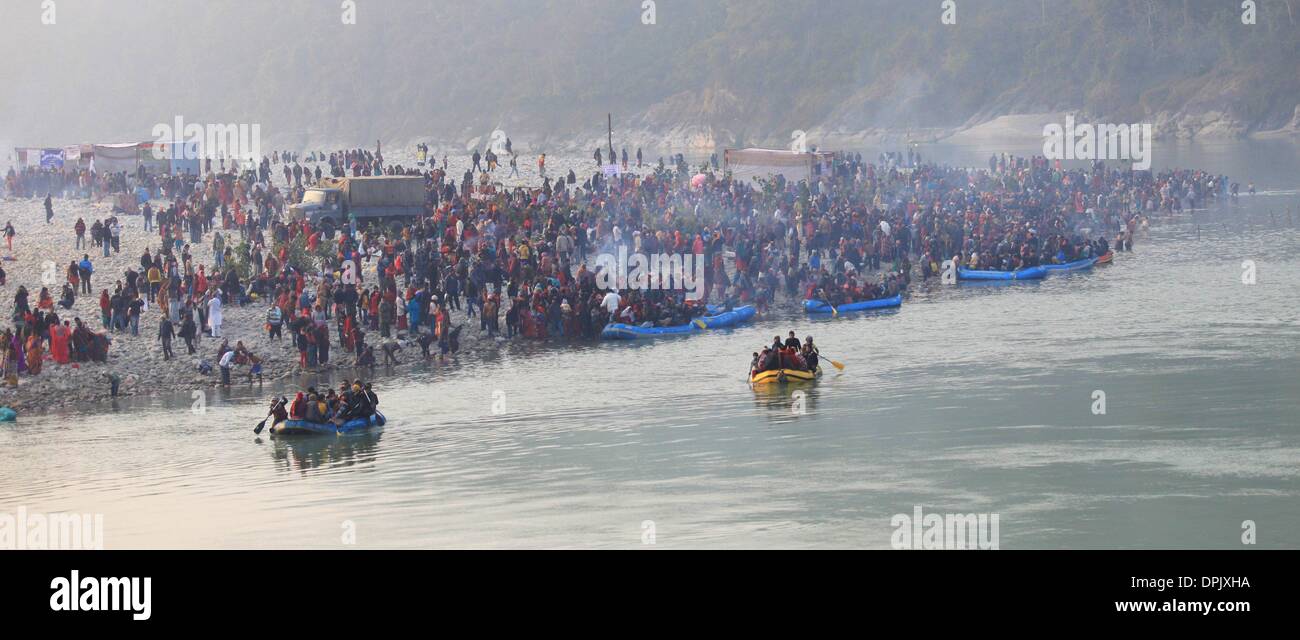Tanahu, Nepal. 15th Jan, 2014. Nepalese Hindu devotees gather at the ...