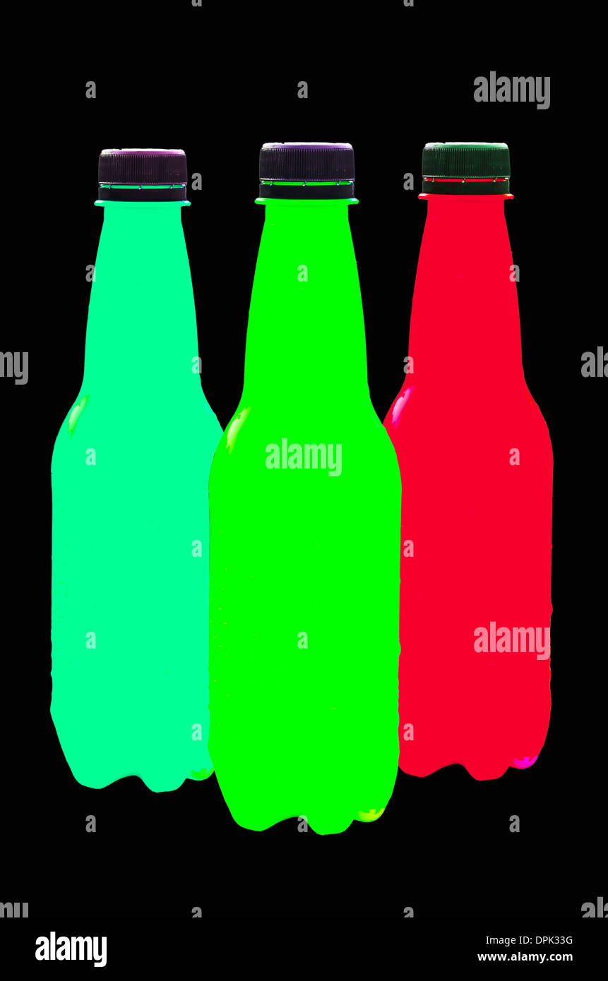 Multi-colored plastic bottles on black background Stock Photo - Alamy