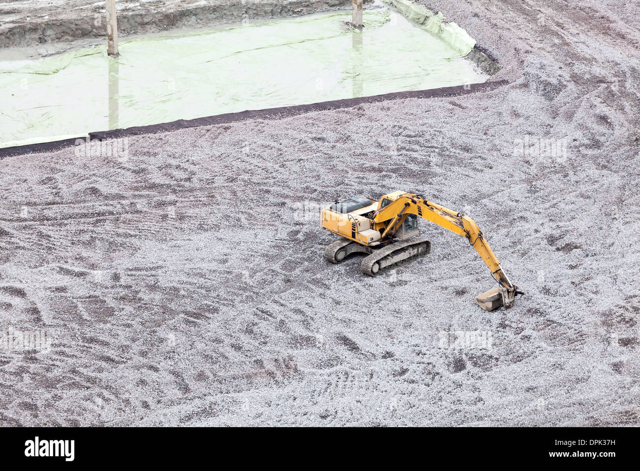 Excavator working with sand on constraction site Stock Photo - Alamy
