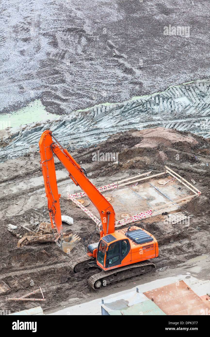 Excavator on a construction site Stock Photo - Alamy