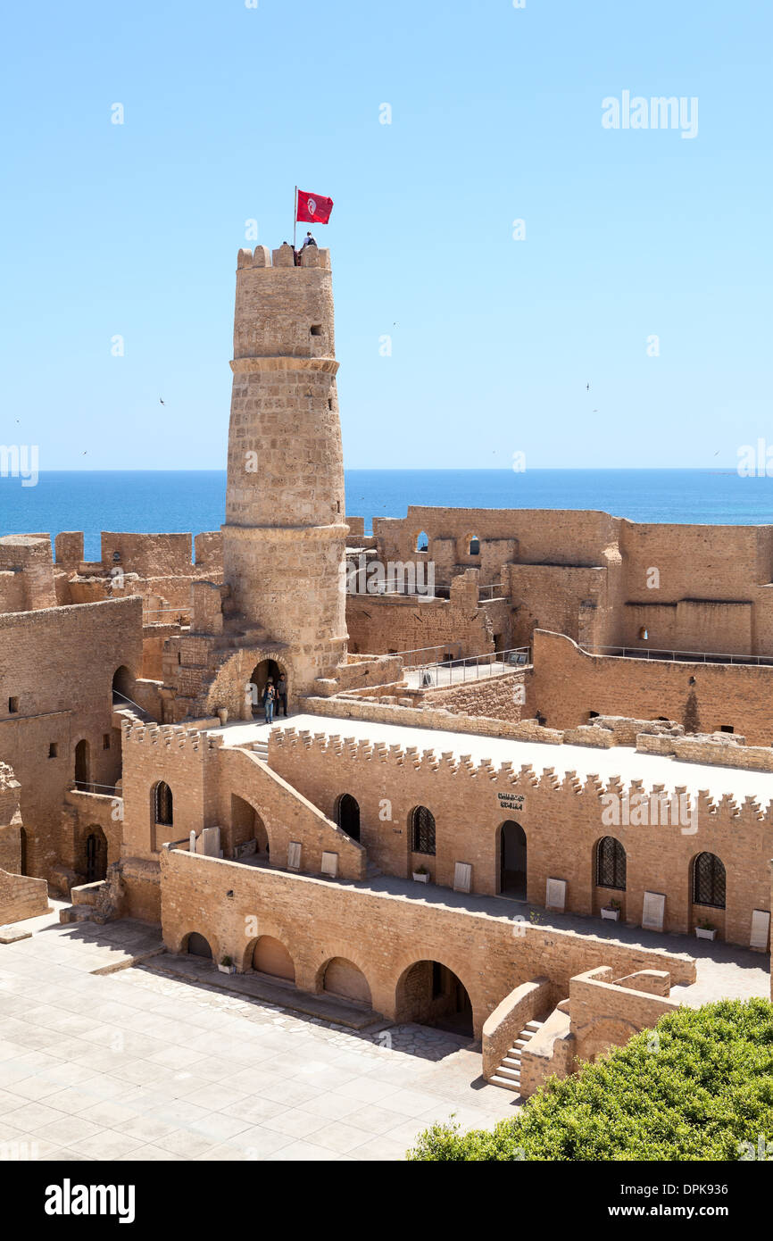 Courtyard Ribat fortress city with a national flag on watchtower on the ...