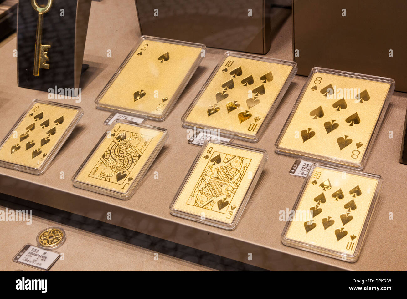 China, Macau, Gold and Jewellery Shop Window, Display of Gold Playing ...
