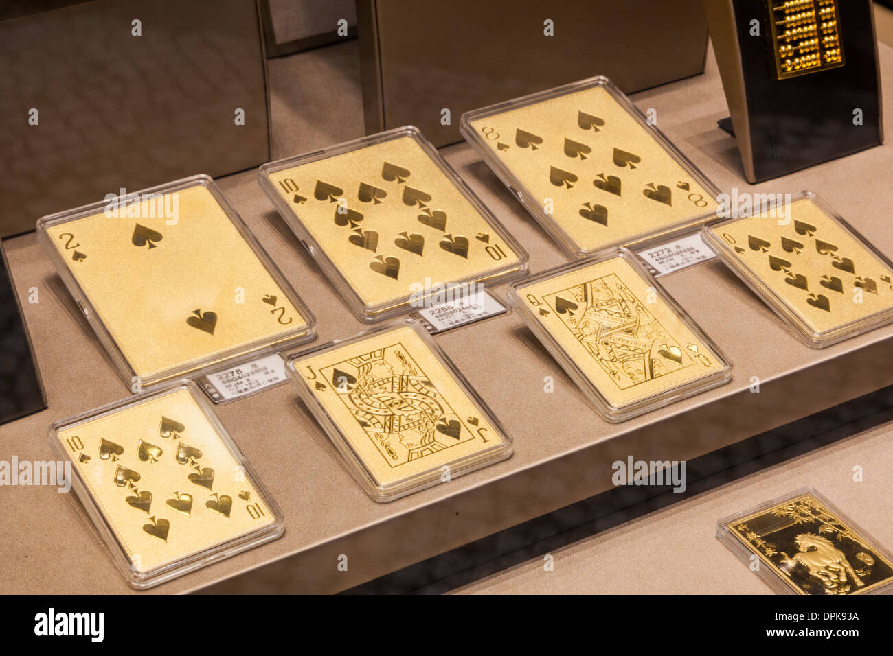 China, Macau, Gold and Jewellery Shop Window, Display of Gold Playing ...