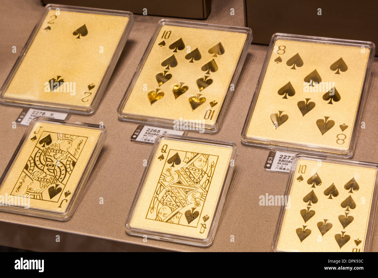 China, Macau, Gold and Jewellery Shop Window, Display of Gold Playing ...