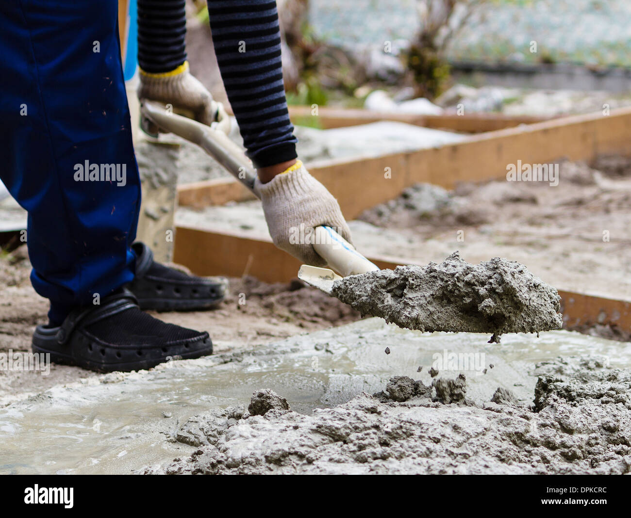 Hand construction worker mixing cement hi-res stock photography and ...