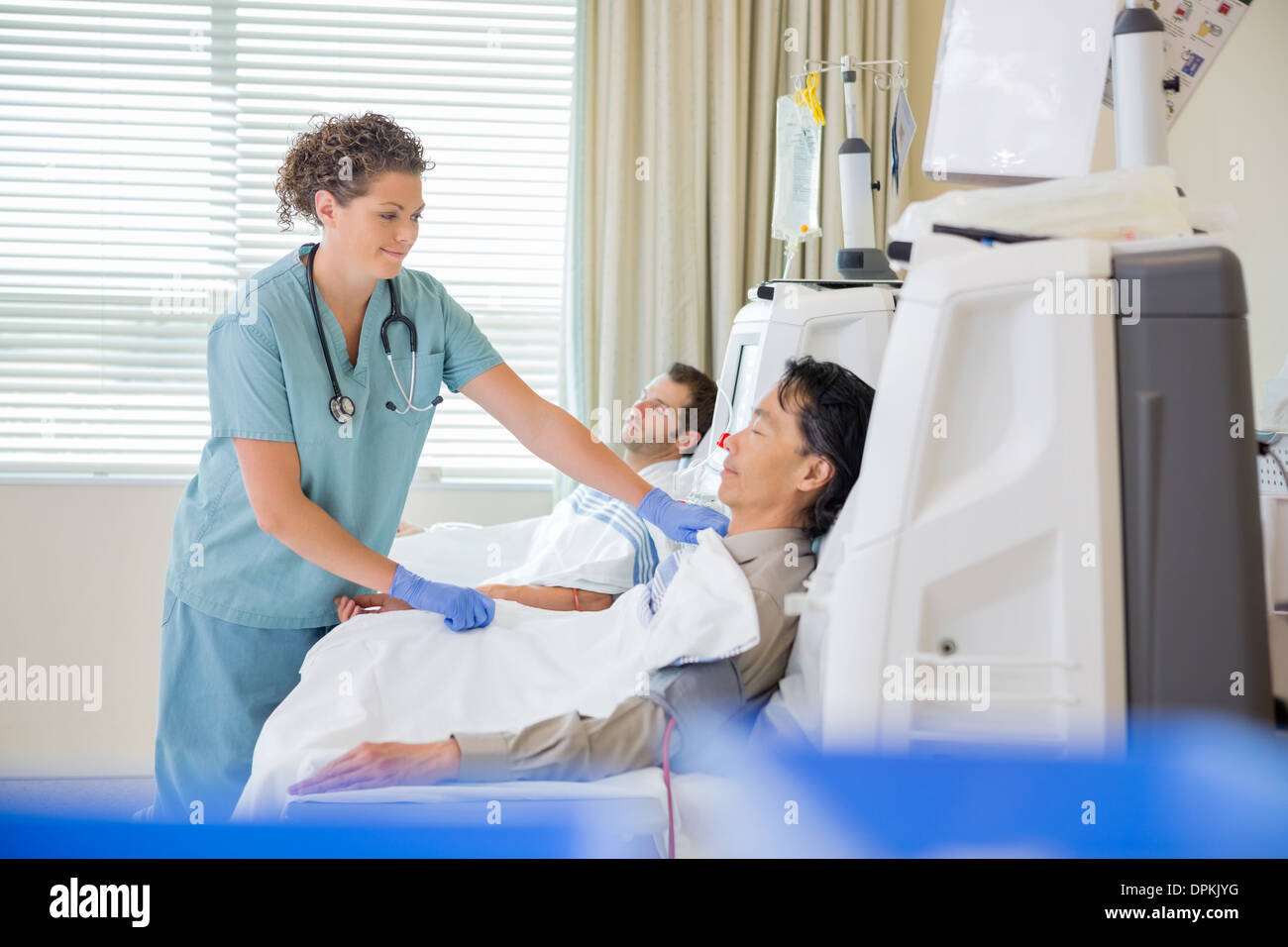 Nurse Assisting Patient Undergoing Renal Dialysis Stock Photo - Alamy