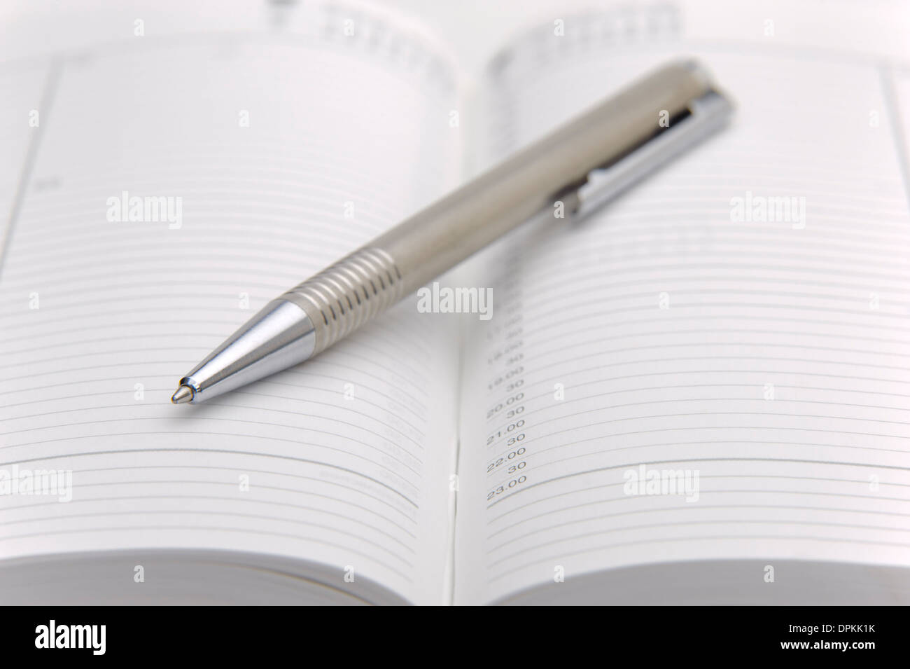 blank time planner and pen Stock Photo - Alamy