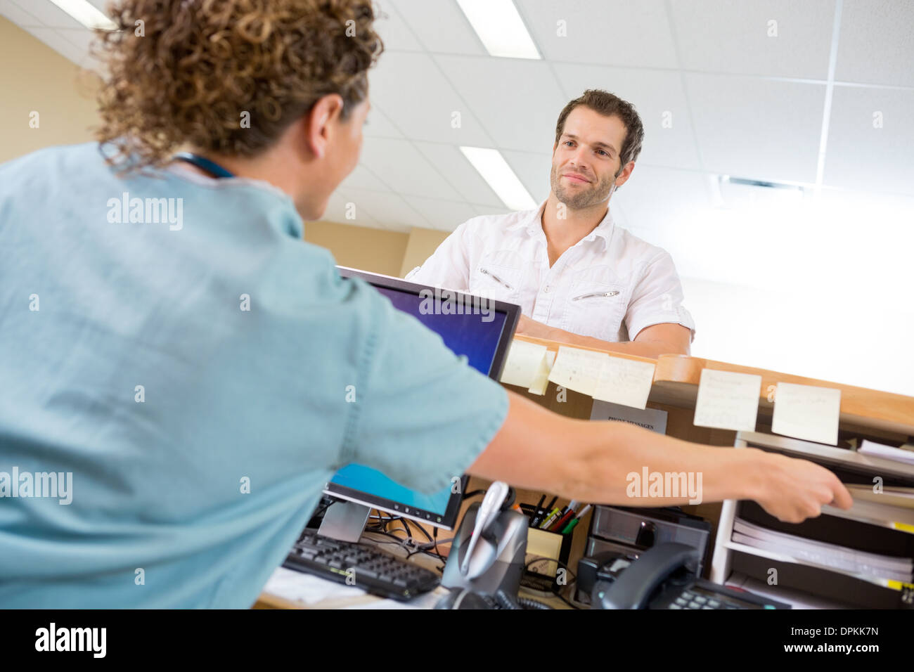 Male secretary desk reception hi-res stock photography and images - Alamy