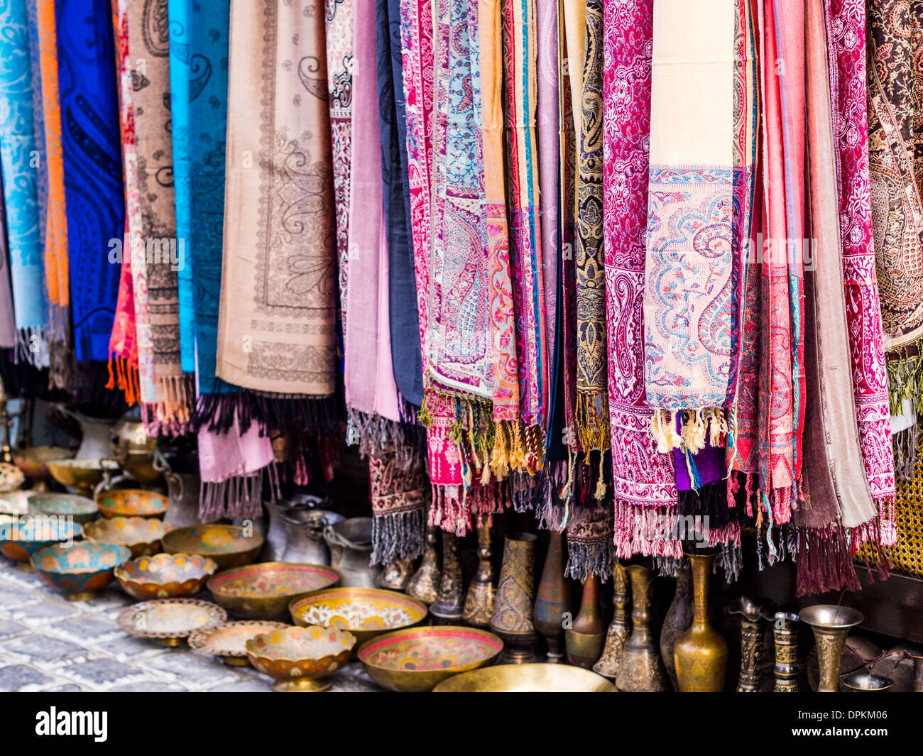 Colorful scarves and other souvenirs sold on a local market in Baku ...