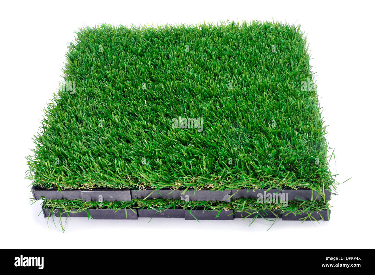 some tiles of artificial turf on a white background Stock Photo - Alamy