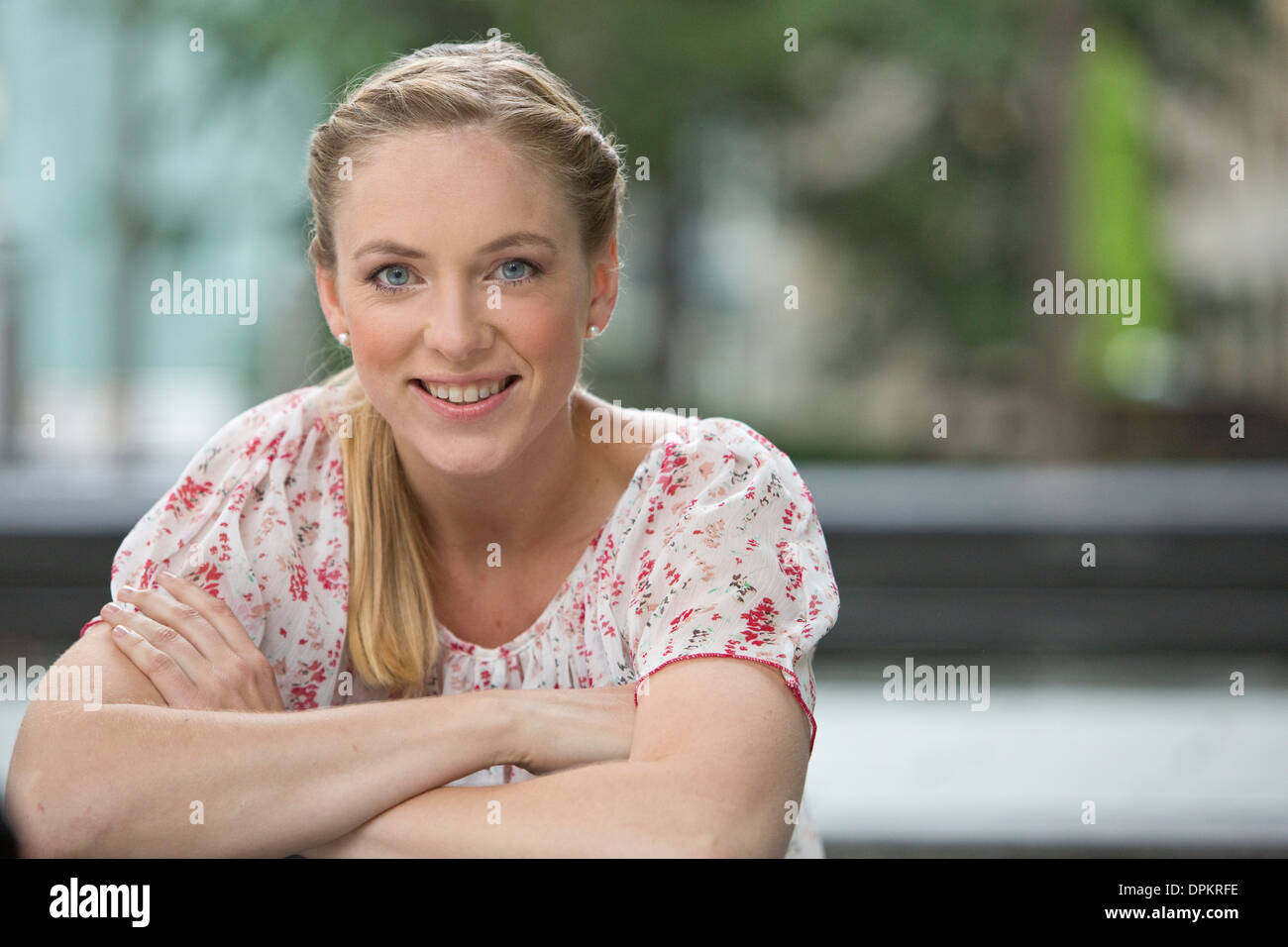 Woman sitting head arms hi-res stock photography and images - Alamy