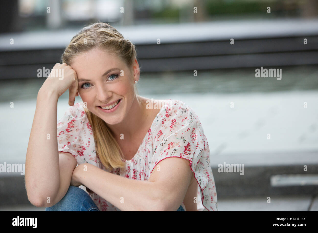 Woman sitting on stairs hi-res stock photography and images - Alamy