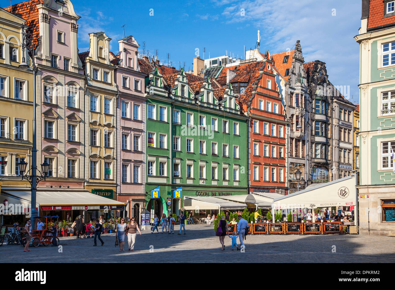 Outdoor restaurant bars and colourful medieval and baroque houses in ...