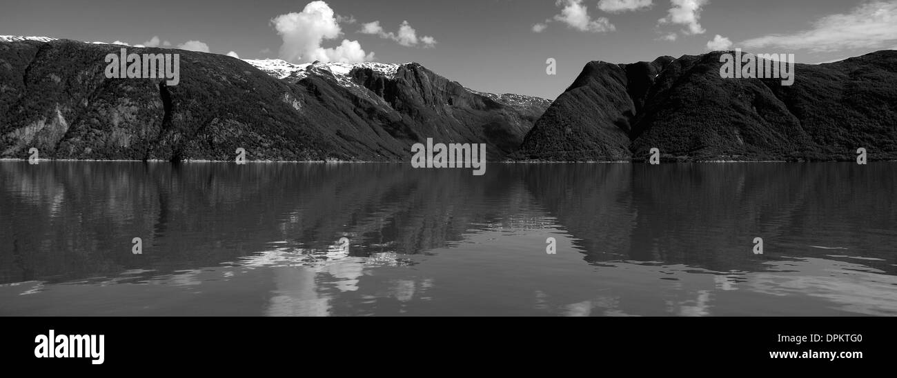 Reflections of the mountains surrounding Hardangerfjord Fjord ...
