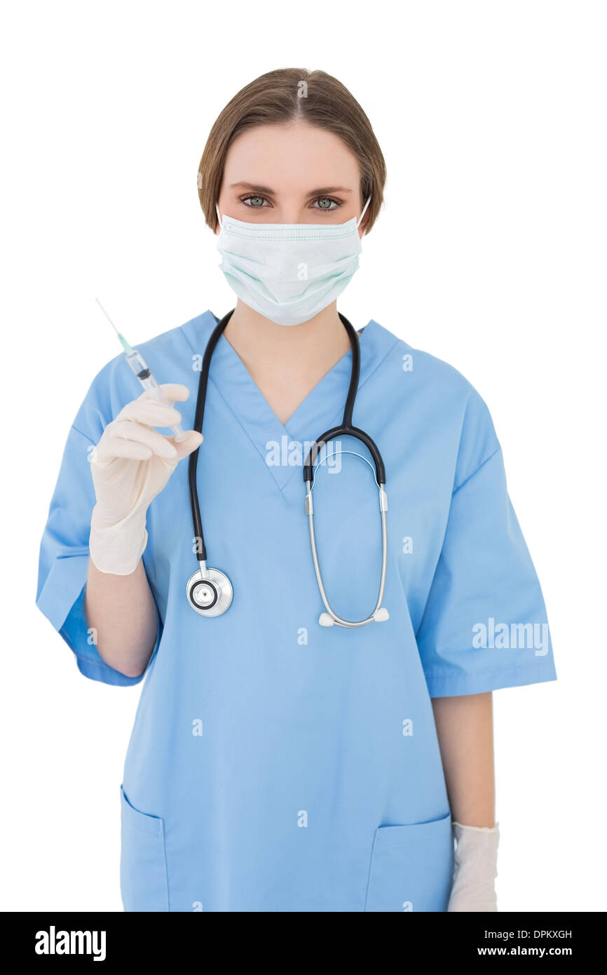 Young female doctor holding an injection Stock Photo - Alamy