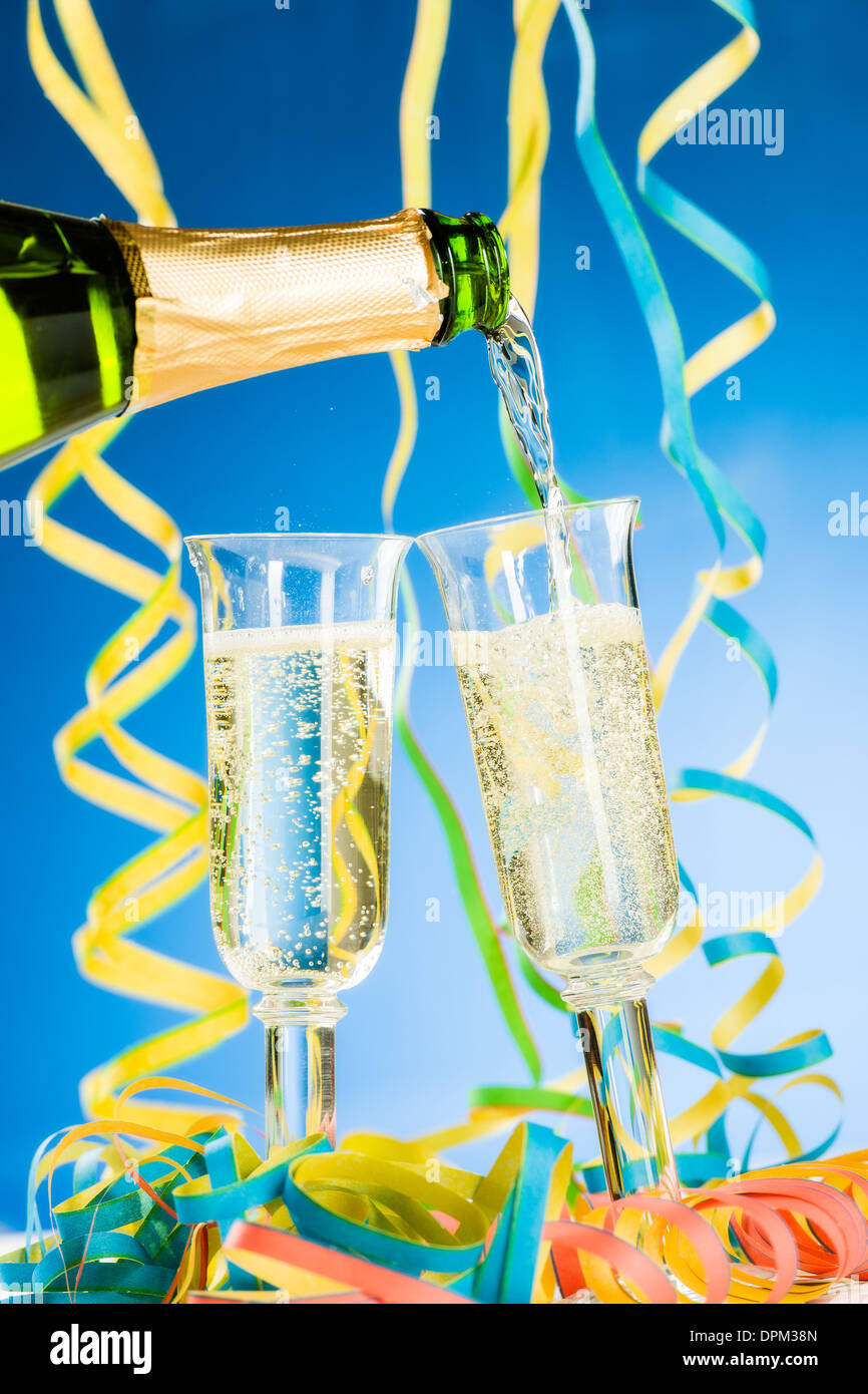 Bottle of champagne and streamers hi-res stock photography and images ...