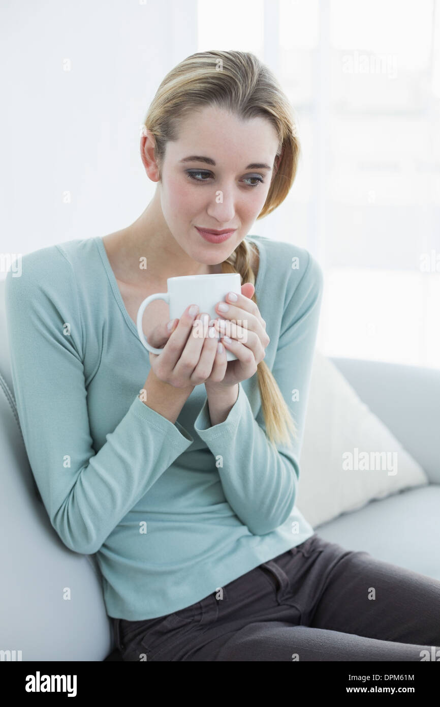 Girl relaxing couch thinking hi-res stock photography and images - Alamy