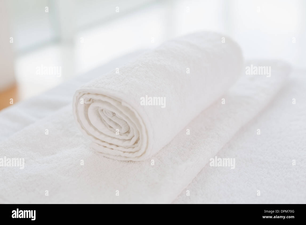 Clean rolled white towels Stock Photo - Alamy