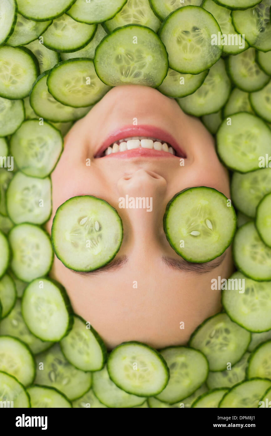 Beautiful woman with facial mask of cucumber slices on face Stock Photo ...
